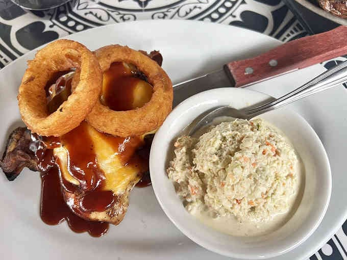 Perfectly grilled chicken with creamy coleslaw proves simple ingredients can create extraordinary comfort on a plate.