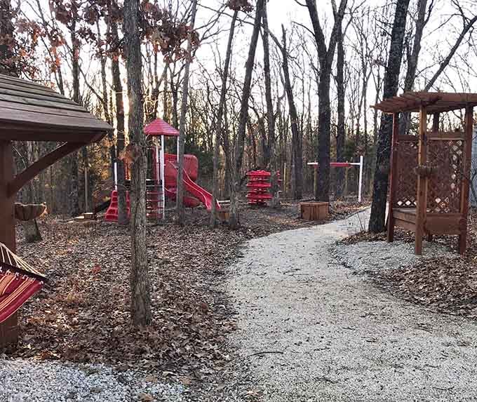 A playground nestled in the woods where kids can burn energy between animal encounters, genius planning right there.