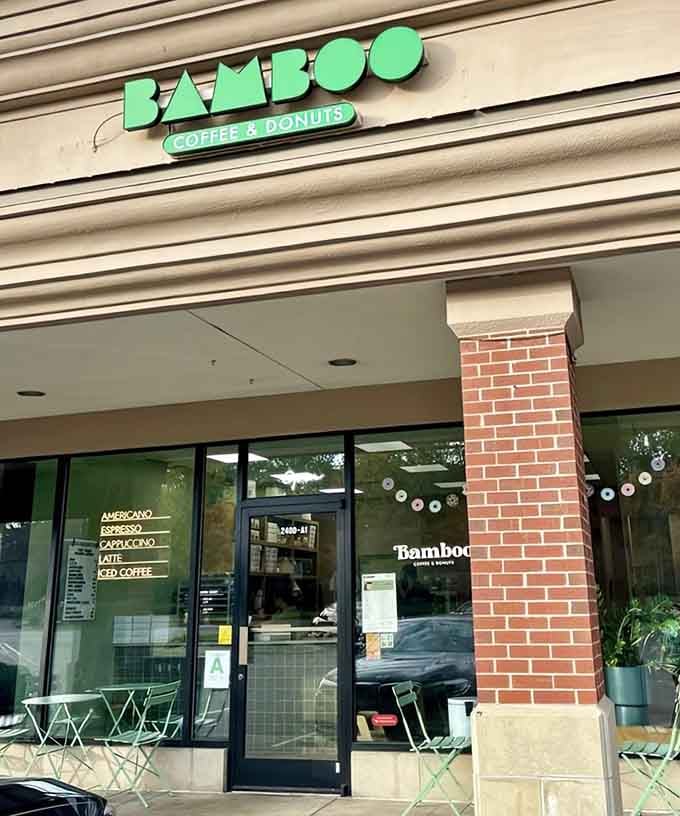 The playful green lettering above promises that coffee and donuts are about to become your new best friends.