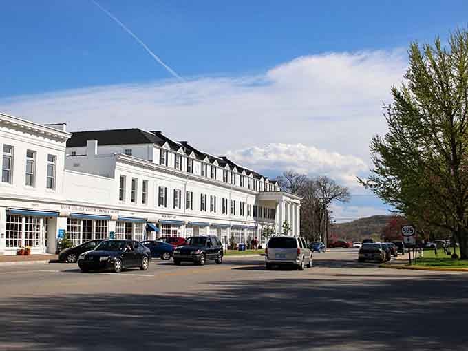 Clean white columns against blue sky create a scene straight out of a classic movie you'd watch on Sunday.