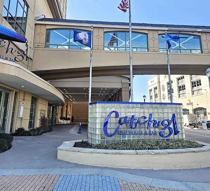 The elegant entrance practically whispers "special occasion," where sustainable seafood meets sophisticated waterfront dining in perfect harmony.