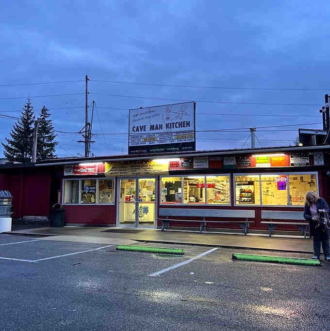 The vintage marquee glows at twilight like an old-time theater, except the show features ribs instead of reels.