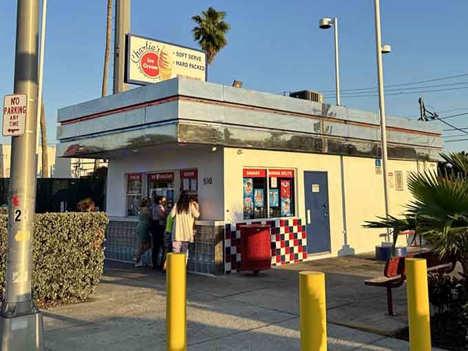 Families gather where the checkered trim meets golden hour light, creating memories one delicious scoop at a time here.