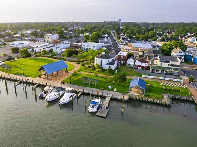 From above, this waterfront town reveals its colorful charm, boats bobbing peacefully like they're taking a nap.