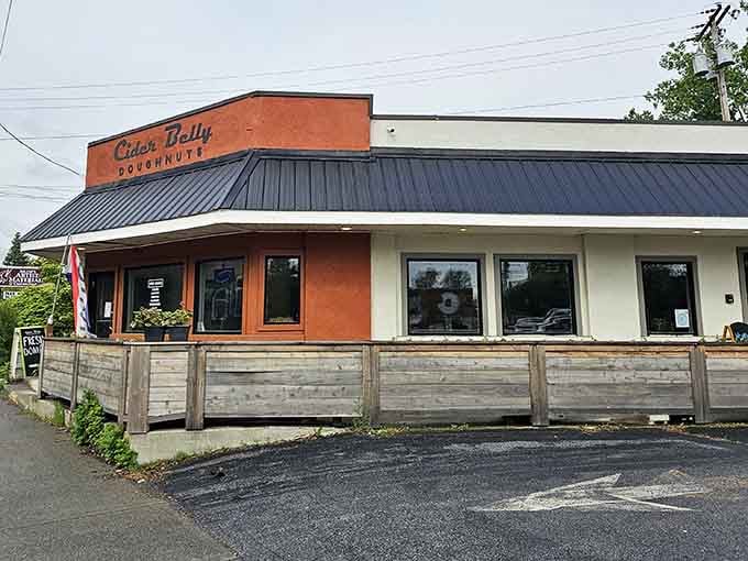 That warm orange facade practically glows with promise, like a beacon calling all donut lovers home for breakfast.