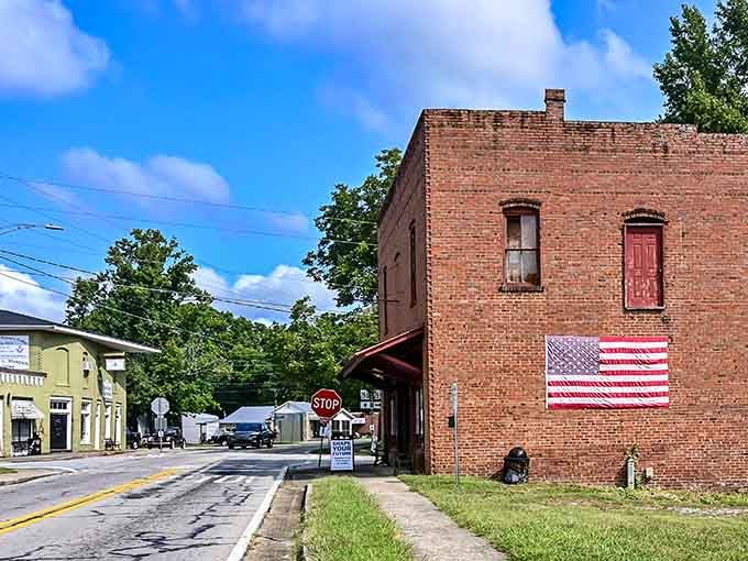 That painted flag on weathered brick says everything about patriotism and small-town values without saying a word at all.