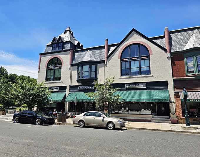 Elegant storefronts with arched windows and green awnings invite leisurely browsing like in the good old days.