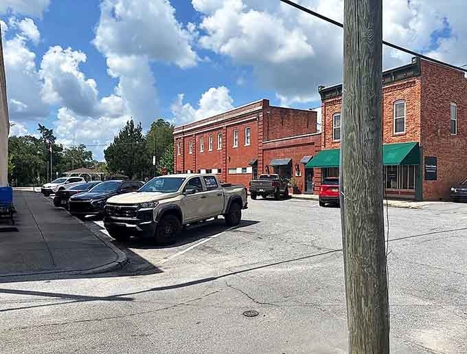 Red brick buildings bask under blue skies where locals park and shop like they've got all day.