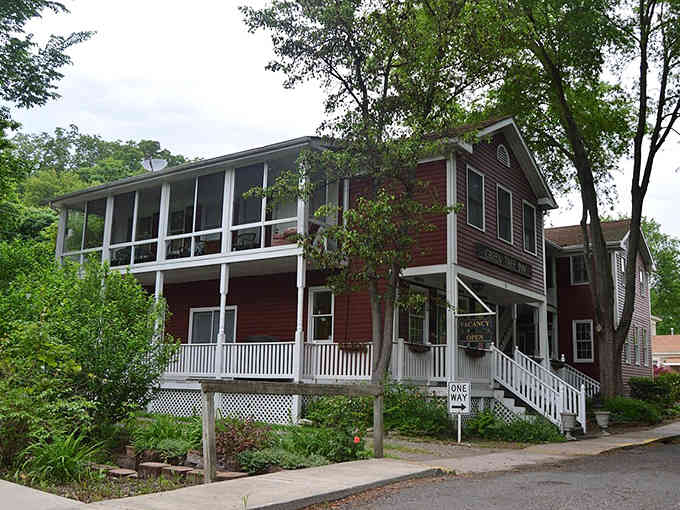 This riverside building's screened porch practically begs you to sit down with lemonade and watch the world drift by.
