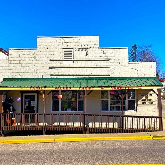 That cheerful wooden porch and bright yellow striping give this thrift shop the welcoming charm of a neighborhood general store.