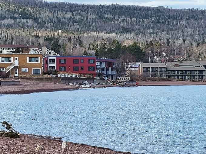 Colorful lakeside buildings huddle together against the wilderness, civilization's cheerful outpost on Superior's wild shore.