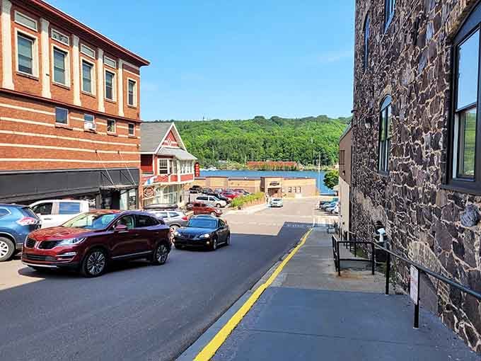 Where the street meets the water, historic buildings frame views that remind you why lakefront living matters so much.