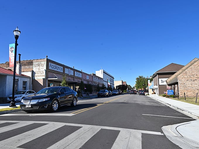 Clean, wide streets invite leisurely strolls past local shops that remember when customer service actually meant something special.