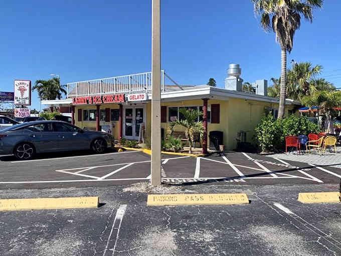 The cheerful yellow exterior and palm trees create that classic Florida roadside charm we all remember from childhood road trips.