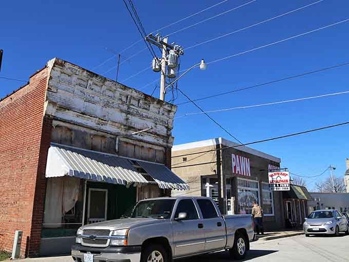 Sunlight illuminates these well-preserved storefronts, where awnings provide shade and local businesses thrive in historic spaces year-round.