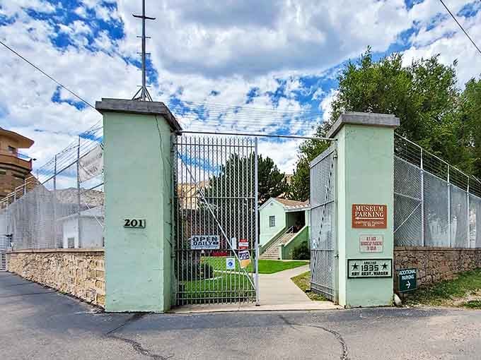 The mint-green pillars frame the pathway to a museum where contraband and consequences tell powerful stories about incarceration.