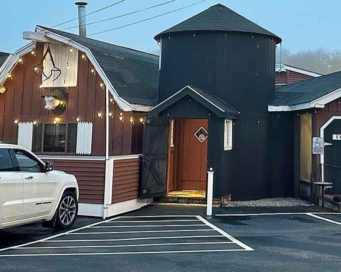 The charming silo and rustic wood siding give this place the authentic New England character that makes every meal feel special.