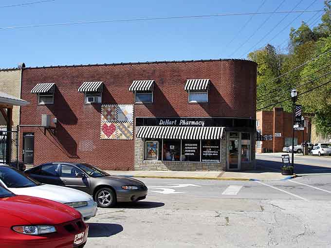 That classic pharmacy with striped awnings looks like it stepped right out of a Norman Rockwell painting.