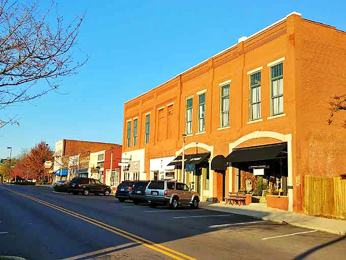 That warm orange brick facade glows in afternoon light like a scene from an old Western movie.