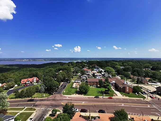 Tree-lined neighborhoods stretch toward the horizon, offering peaceful living where your savings can actually last and grow.