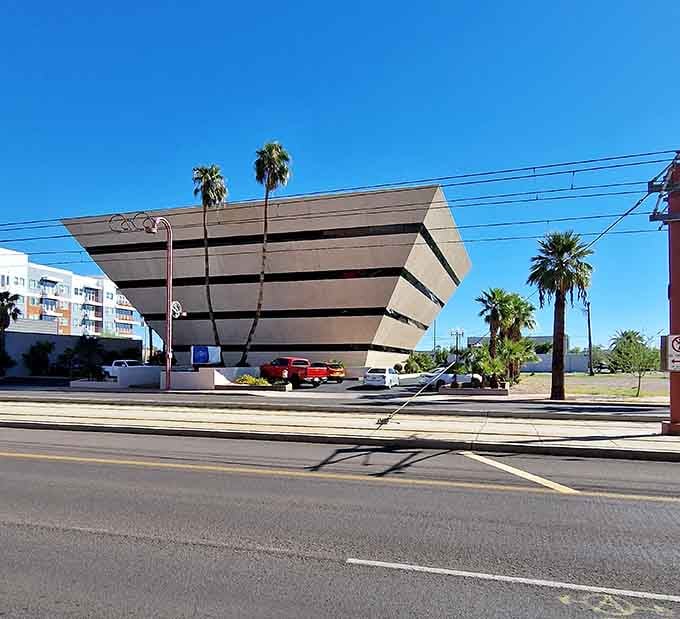 Those horizontal stripes wrapping around the pyramid make this office building look like a sophisticated layer cake of concrete.