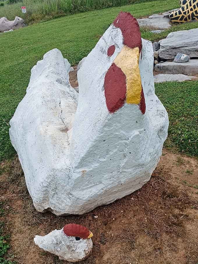 This cheerful painted chicken made from a massive boulder proves someone had serious artistic vision and time.