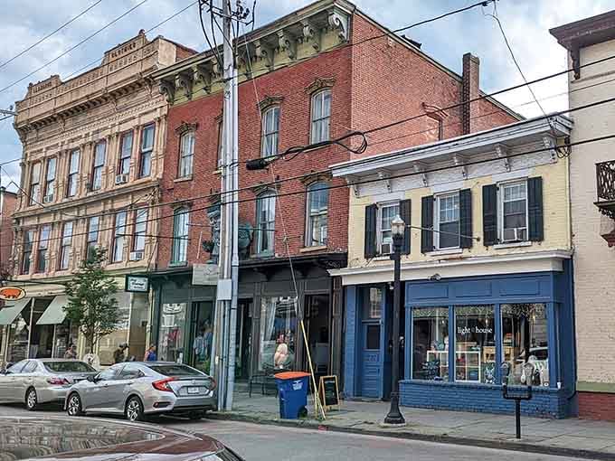 Each storefront tells its own story with different colored facades creating a patchwork of small-town charm.