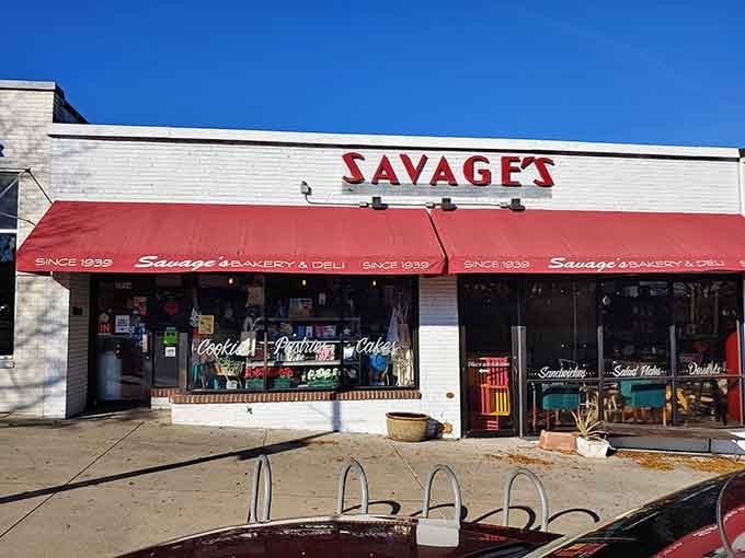 Bold red awnings announce a bakery institution where generations have celebrated life's sweetest moments with fresh-baked goods.