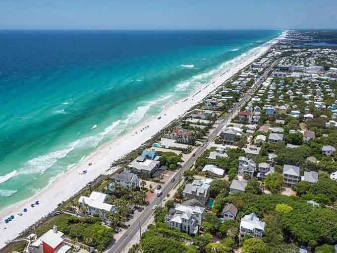 That emerald Gulf water against sugar-white sand creates a color combination so perfect it looks like someone's desktop screensaver come alive.