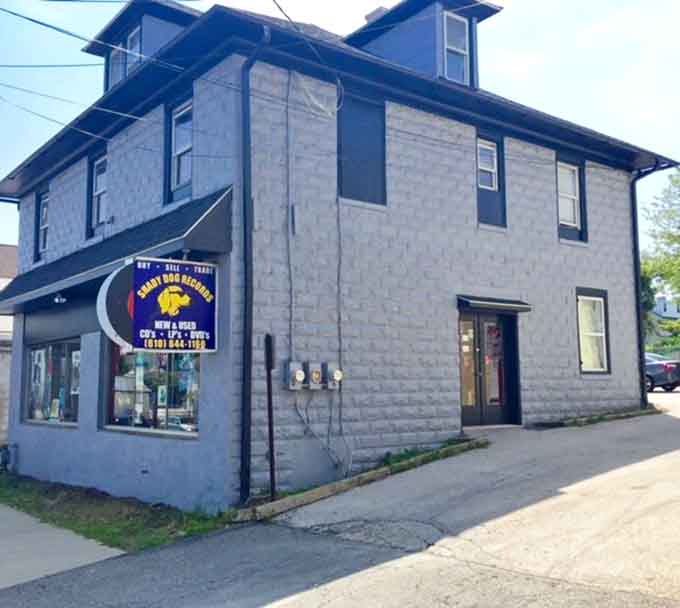 The blue-painted building brings charm to this corner spot, where vinyl collectors gather like old friends.