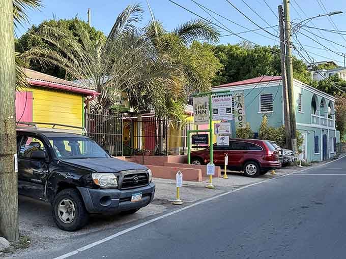 Stroll through this vibrant, colorful street scene, where charming local businesses create a welcoming and lively atmosphere.