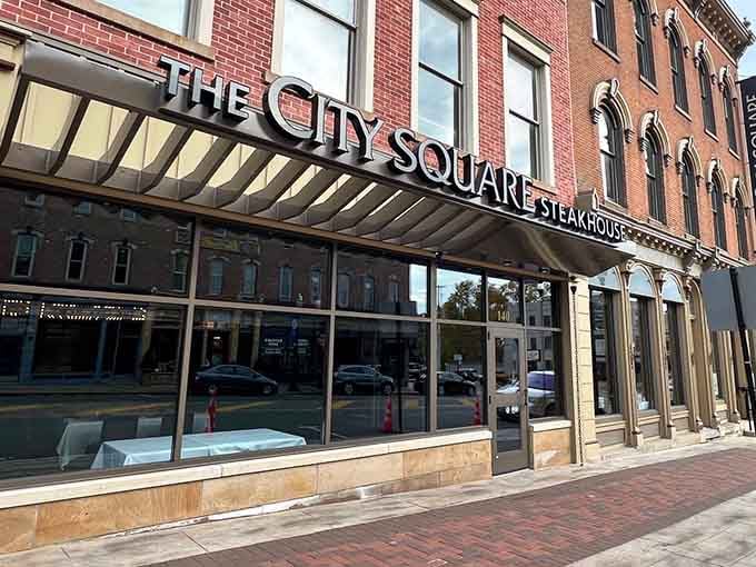 Historic brick and contemporary glass create downtown dining magic where old-world charm embraces modern steakhouse sophistication beautifully.