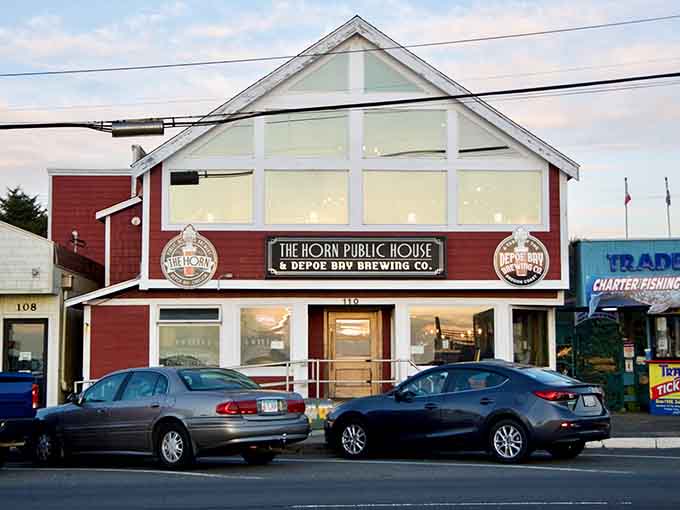 The red exterior pops against coastal skies like a lighthouse guiding hungry travelers to fresh catches.