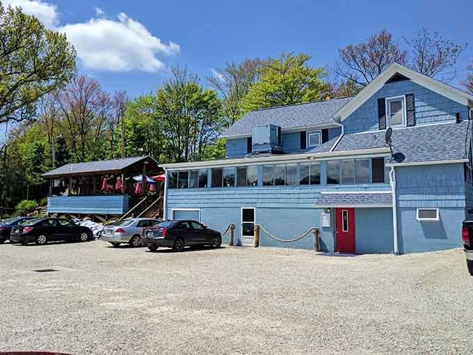 The packed parking lot and blue-painted charm tell you locals have discovered this waterside treasure already.