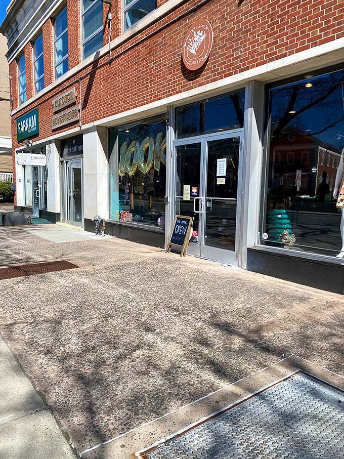 Classic brick architecture meets modern thrift shopping where downtown charm welcomes savvy bargain hunters through those doors.