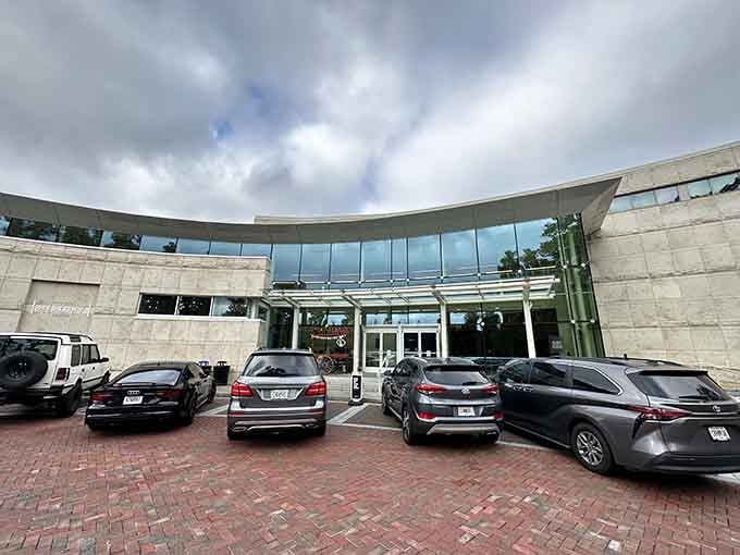 Dramatic clouds frame this modern entrance where generations discover stories that shaped the city we know today.