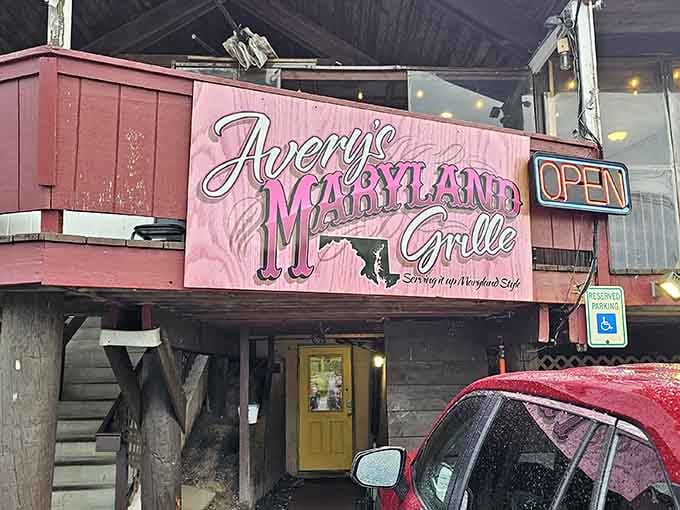 That pink neon "OPEN" sign glows like a beacon for anyone craving authentic Maryland-style crab feasts. Photo credit: K M