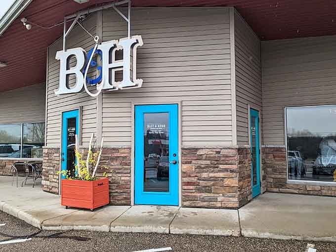 Cheerful planters frame the entrance to this charming spot where fresh fish meets heartland hospitality in delightful harmony.