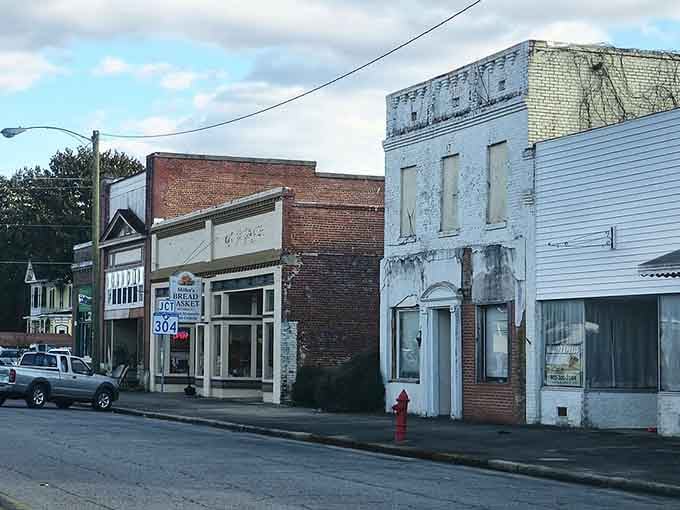 Ghost signs and faded paint tell silent stories on buildings that remember busier, louder times.