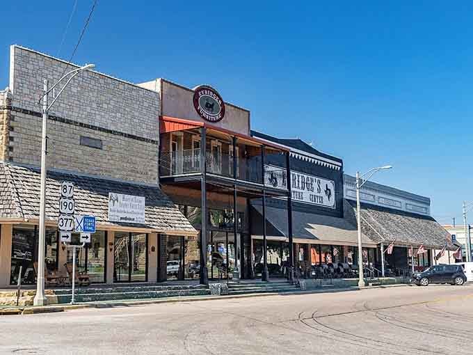 The colorful awnings create a rainbow of local businesses, each one family-owned and genuinely happy to see you walk in.