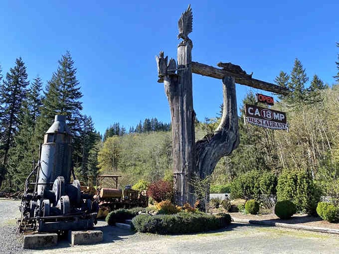 That towering carved gateway and steam donkey engine welcome guests to a lumber camp dining experience like no other.