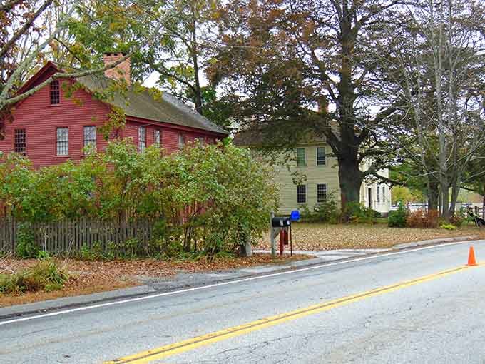 Colonial-era buildings line the roadside like sentinels of history, their weathered charm speaking volumes about New England's enduring character.