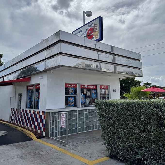 The vintage signage and palm trees frame this classic corner where Hialeah comes for their soft serve fix daily.