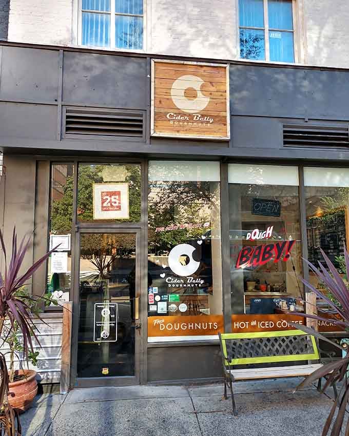 Modern meets cozy with those big windows inviting you in for handcrafted treats that taste like someone actually cares.