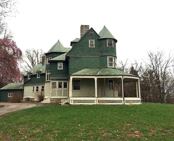 Those turrets and wraparound porch belong in a Victorian novel, not sitting quietly in the Illinois countryside waiting for visitors.