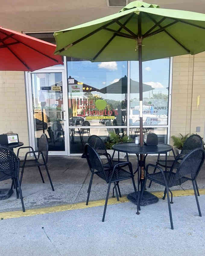 The colorful patio setup invites you to relax and savor every crispy, tangy bite in the sunshine.