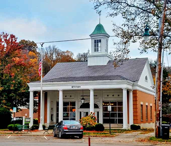 That charming cupola and white columns give serious "Mayberry meets New England" vibes in the best possible way.