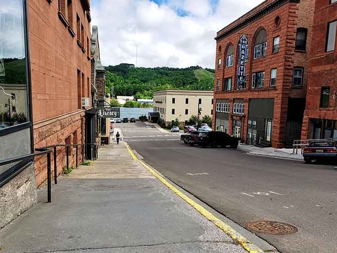 Sloping sidewalks lead down to the waterfront, blending old-world architecture with natural beauty in perfect harmony.