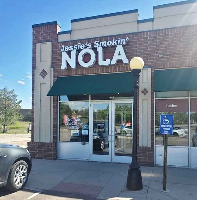 Under that green awning lies a culinary portal where beignets and powdered sugar await your delighted discovery.