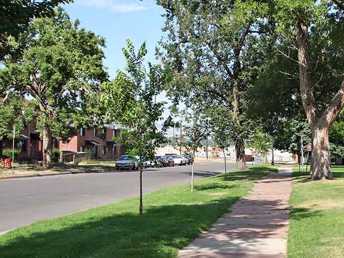 Mature trees shade the sidewalks in this quiet neighborhood where front porches still mean something to the community.